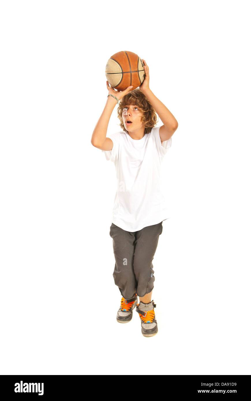 Teen boy playing basketball isolated on white background Stock Photo ...