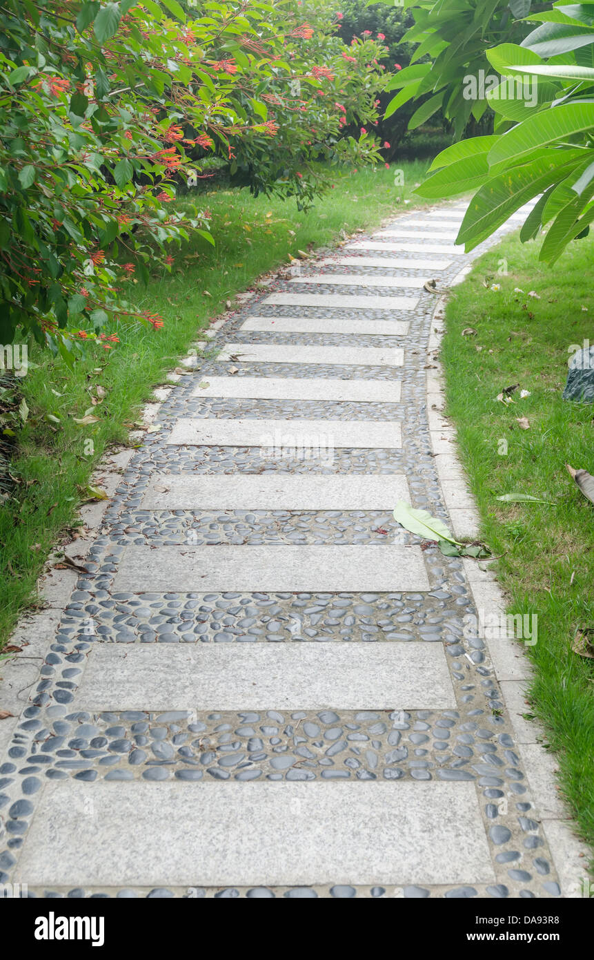 Bending garden stone path Stock Photo - Alamy
