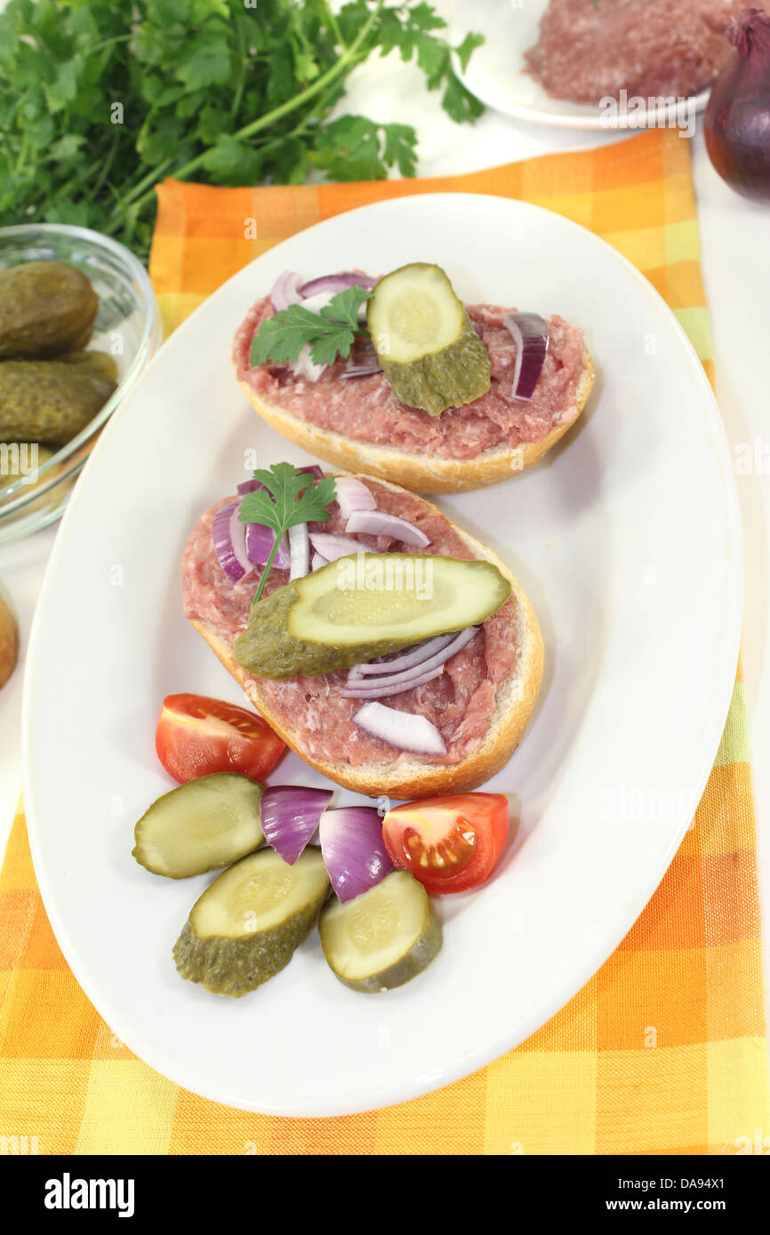white bread with pickles and onions on a light background Stock Photo ...