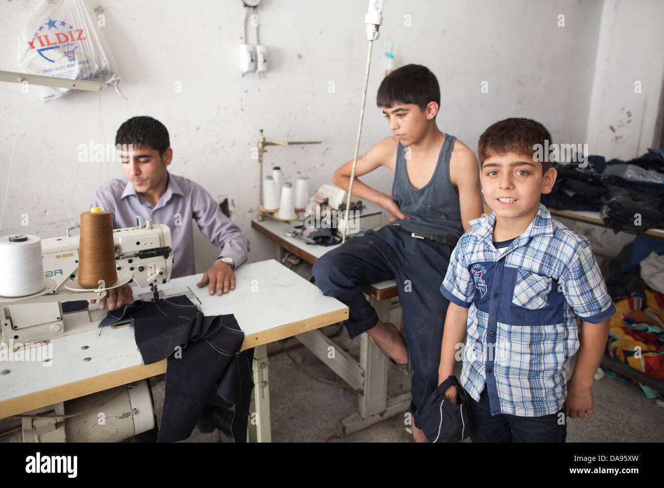 Young men working in a Turkish tailors shop, Gaziantep, Turkey Stock ...