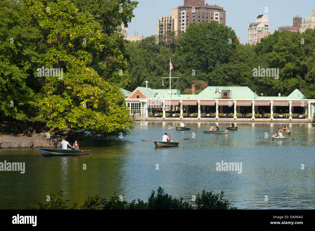 PEOPLE ROWING BOATS BOATHOUSE THE LAKE CENTRAL PARK MANHATTAN NEW YORK ...