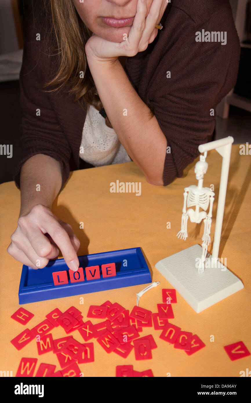 Woman playing Hangman board game Stock Photo - Alamy