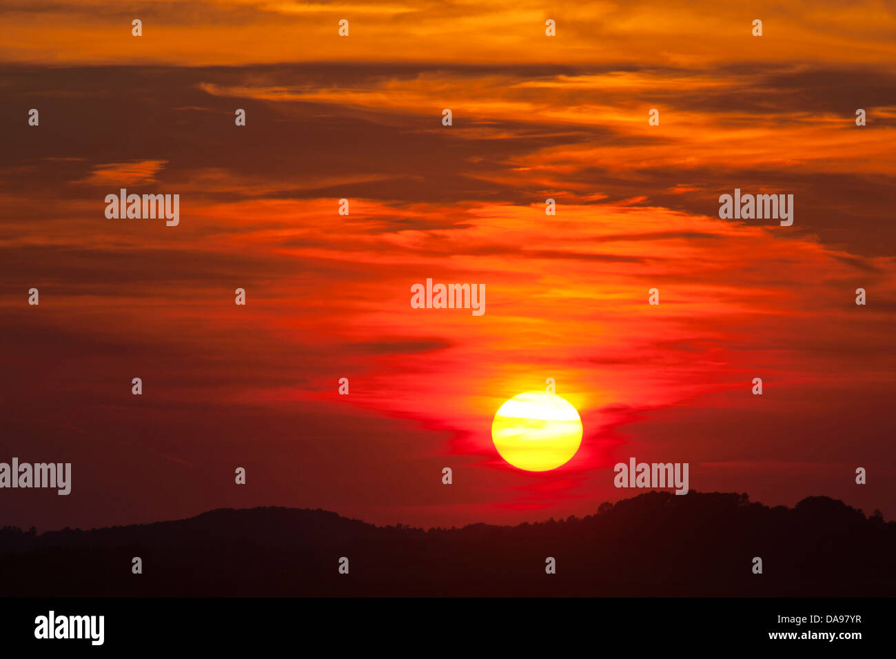 SUNSET OVER LAND Stock Photo - Alamy