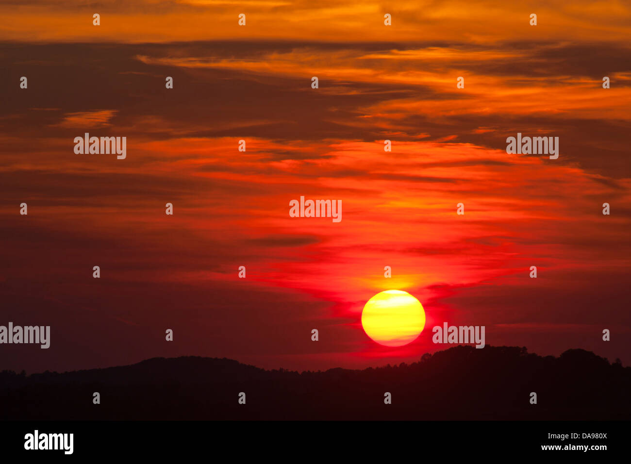 SUNSET OVER LAND Stock Photo - Alamy