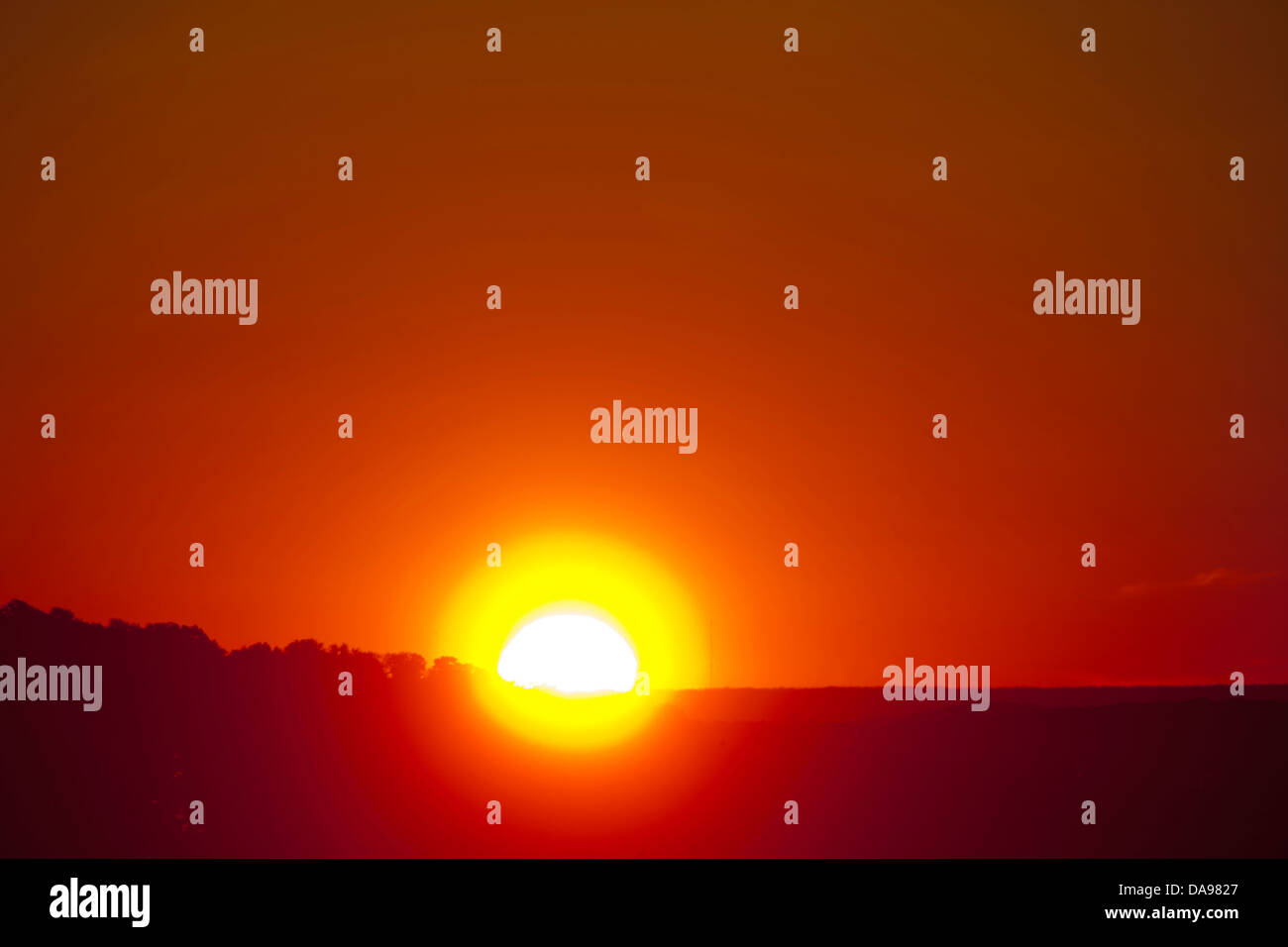 SUNRISE OVER LAND Stock Photo - Alamy