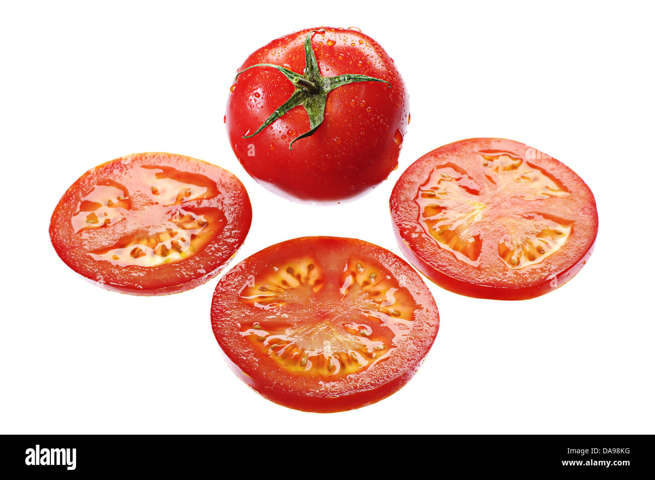 One tomato and three slices isolated on white Stock Photo - Alamy
