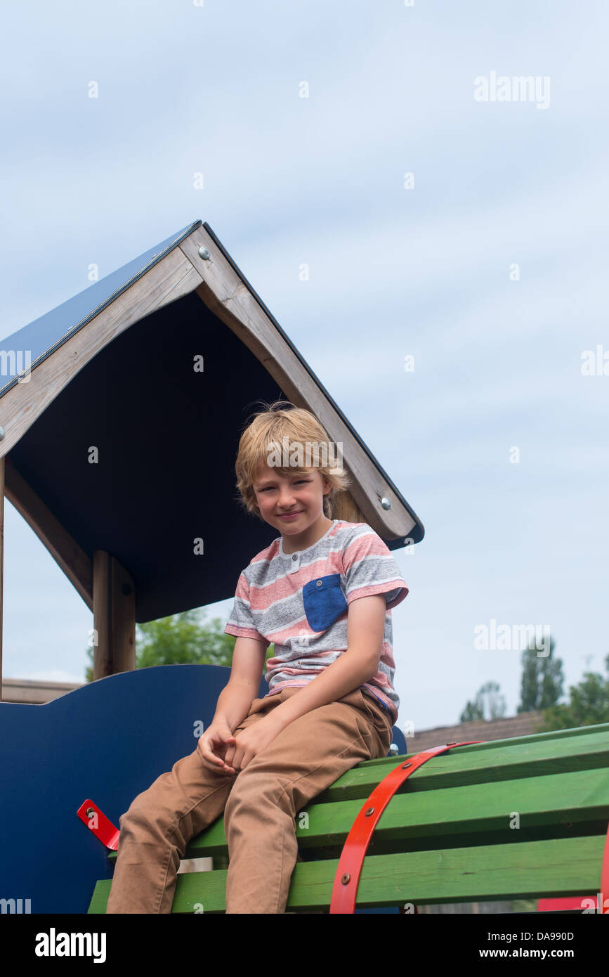 young white boy playing in playground Stock Photo - Alamy