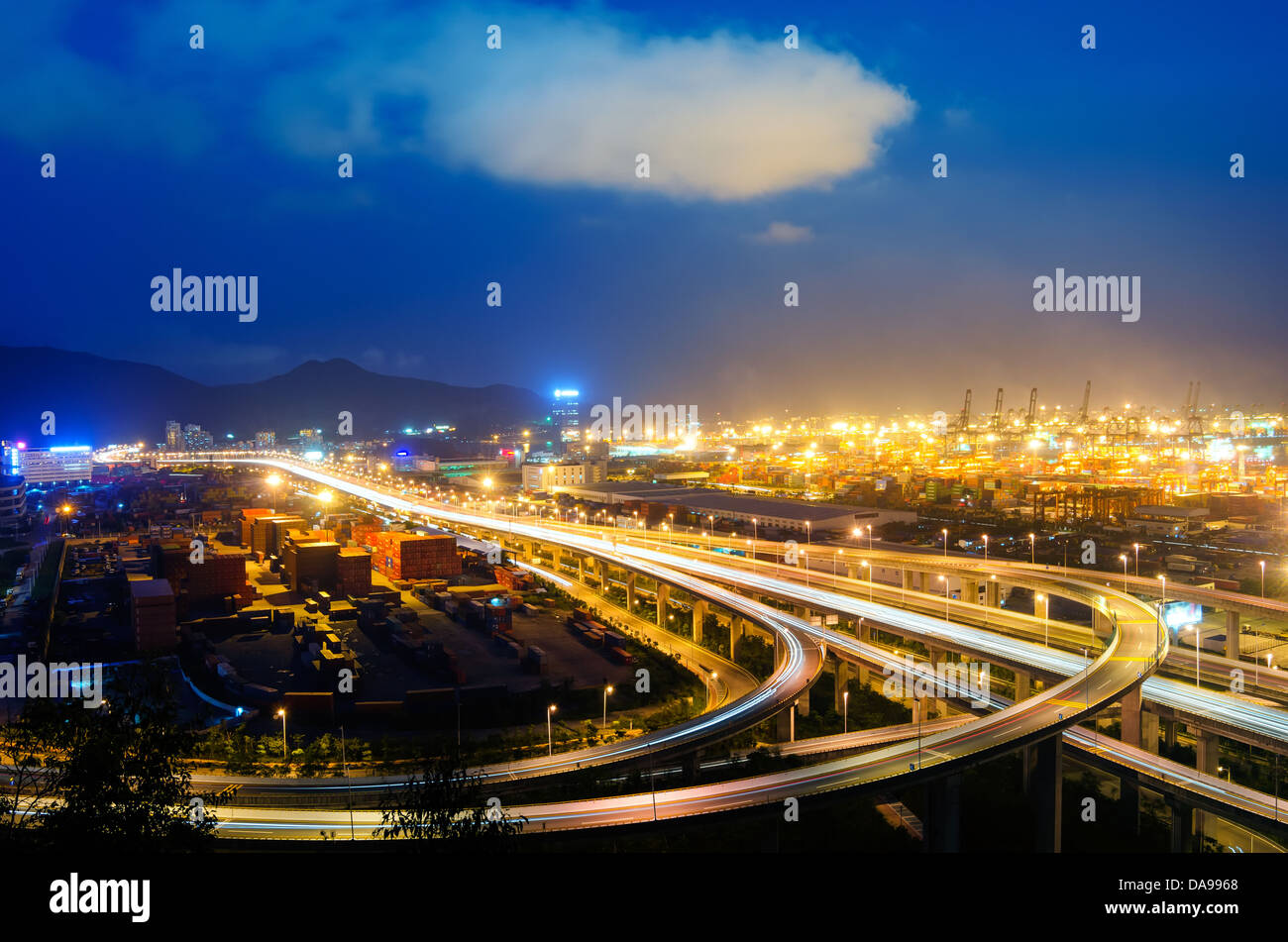 Freeway in night with cars light in modern city Stock Photo - Alamy