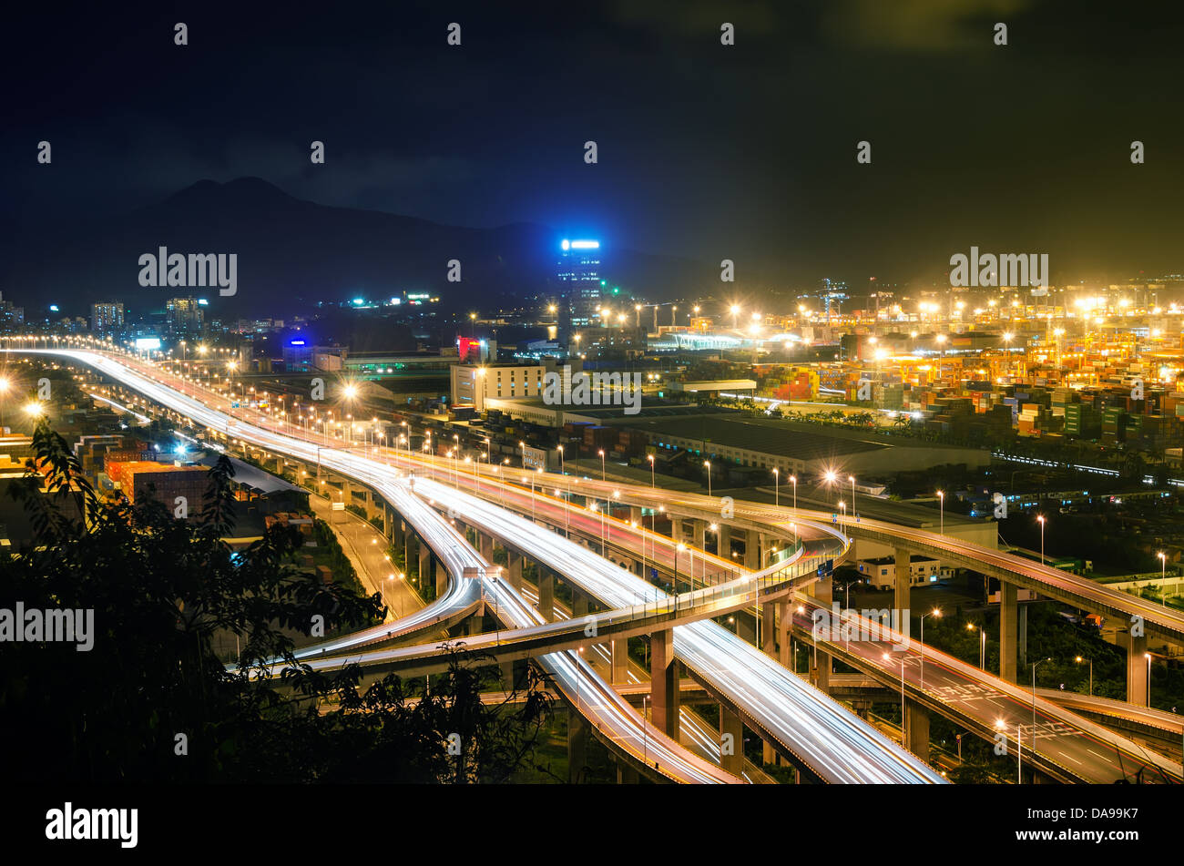 Freeway in night with cars light in modern city Stock Photo - Alamy