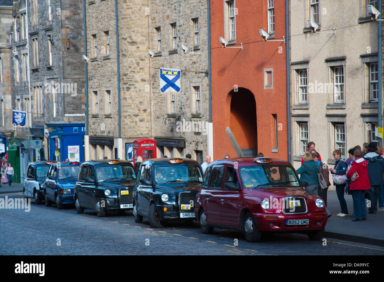Taxis along High Street the Royal Mile old town Edinburgh Scotland ...