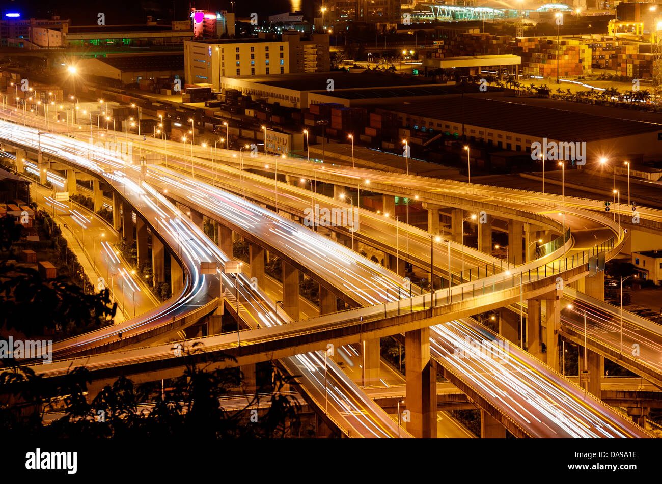 Freeway in night with cars light in modern city Stock Photo - Alamy
