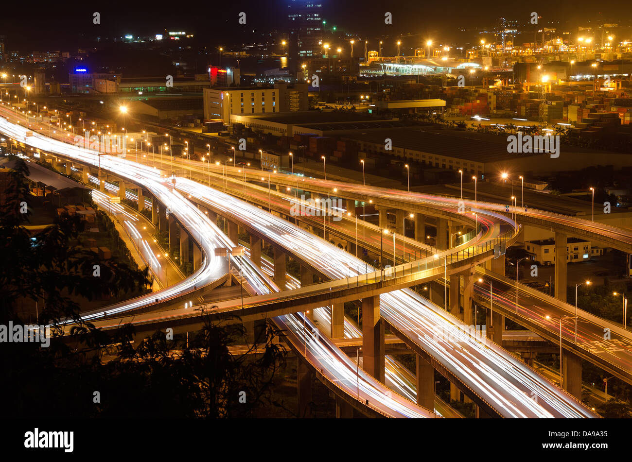 Freeway in night with cars light in modern city Stock Photo - Alamy