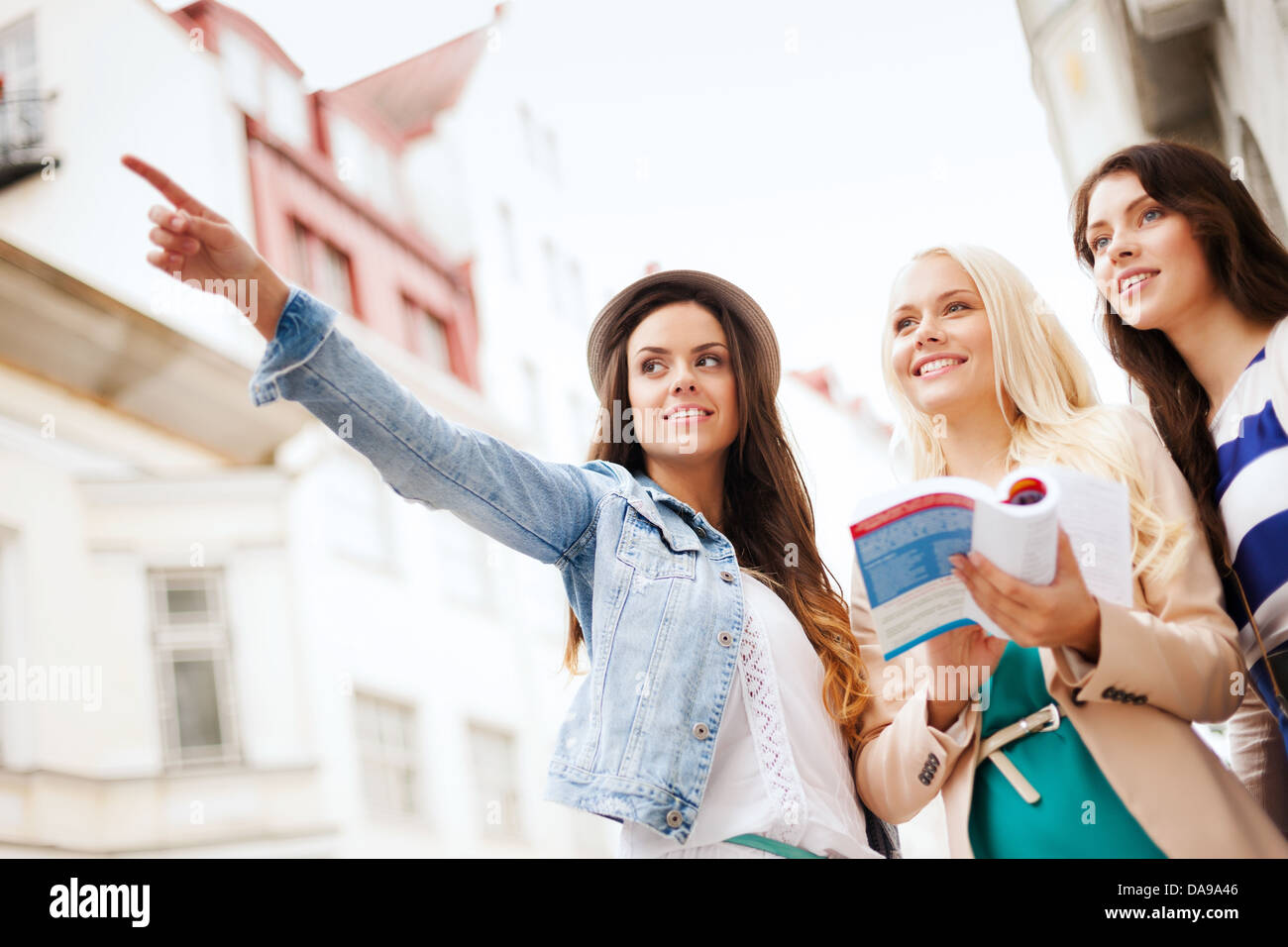 beautiful girls looking for direction in the city Stock Photo - Alamy