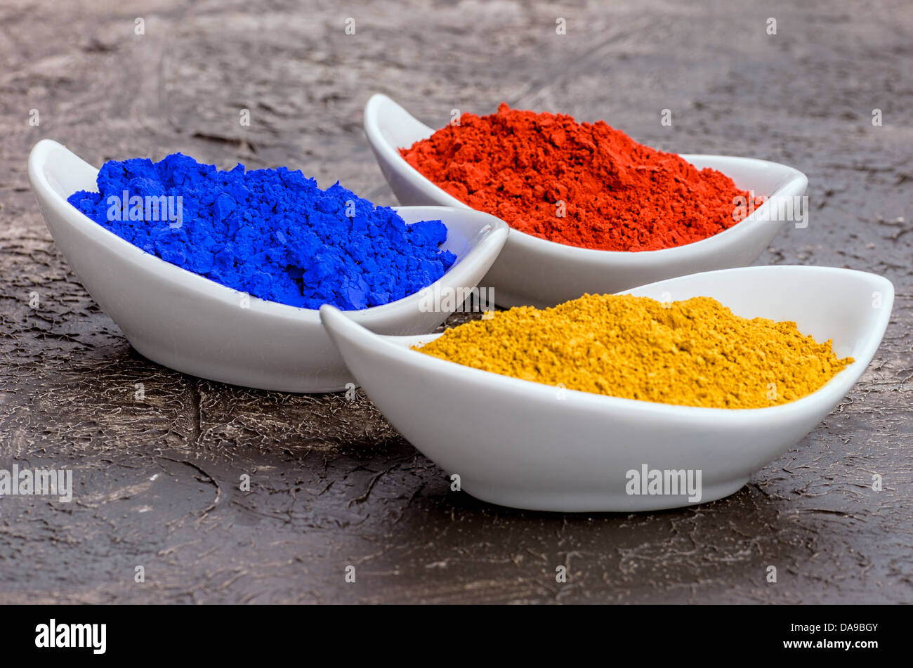 Vibrant color pigments in porcelain bowls Stock Photo - Alamy