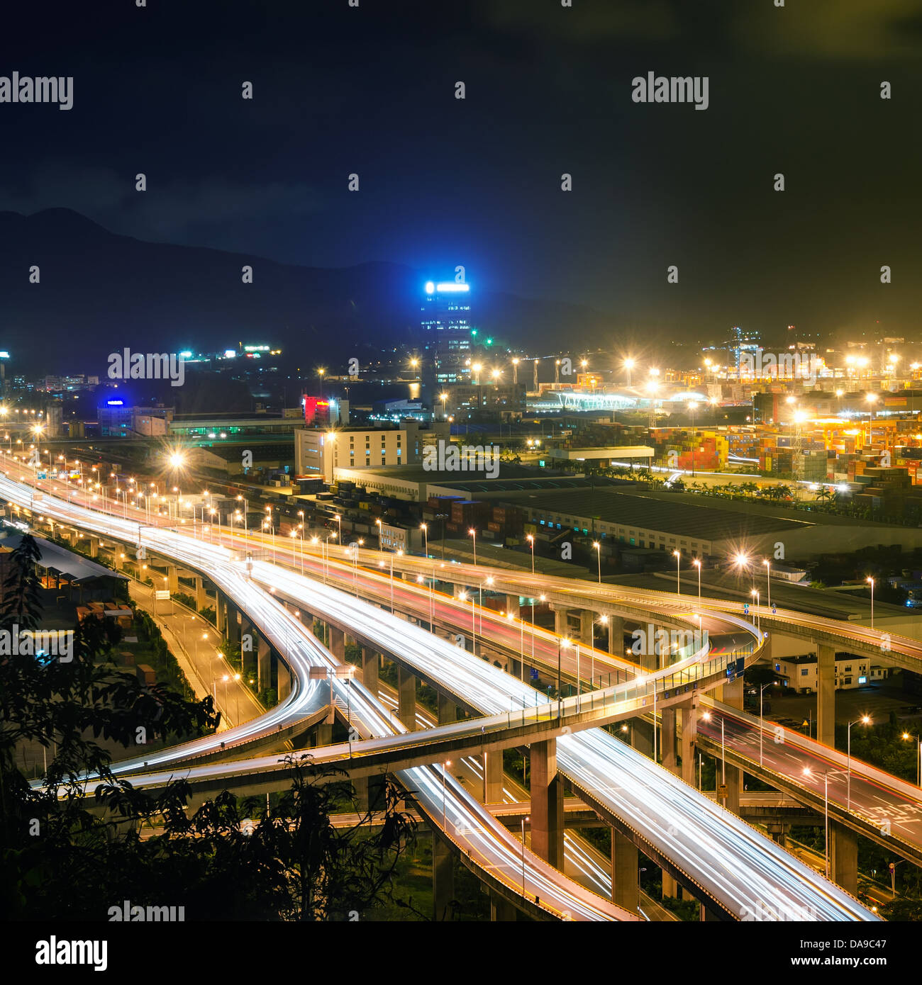 Freeway in night with cars light in modern city Stock Photo - Alamy