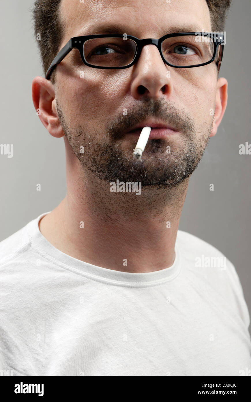 Man smoking a cigarette Stock Photo - Alamy