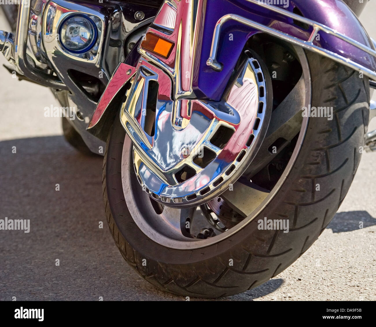 Wheel of blue with red strips motorcycle, power symbol Stock Photo - Alamy