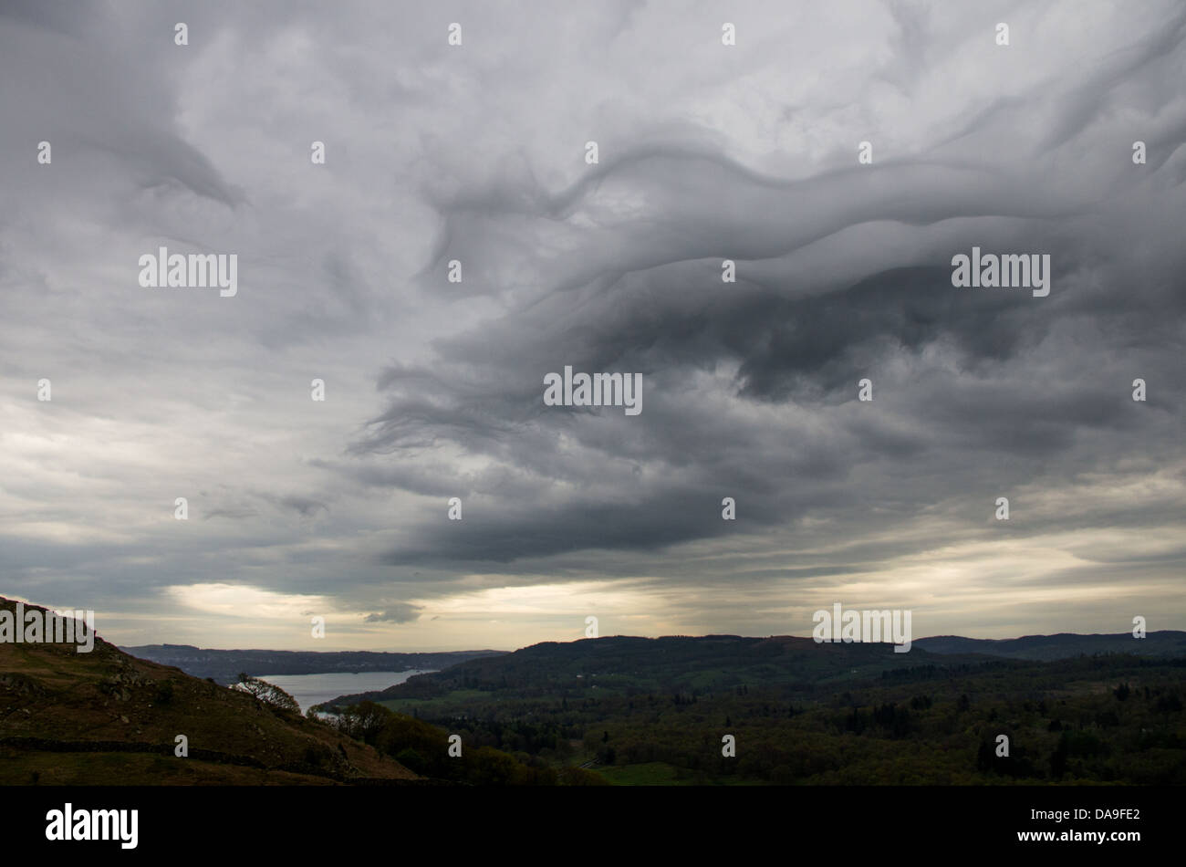 Grey stormy cloud formations over Esthwaite valley and Windermere as ...