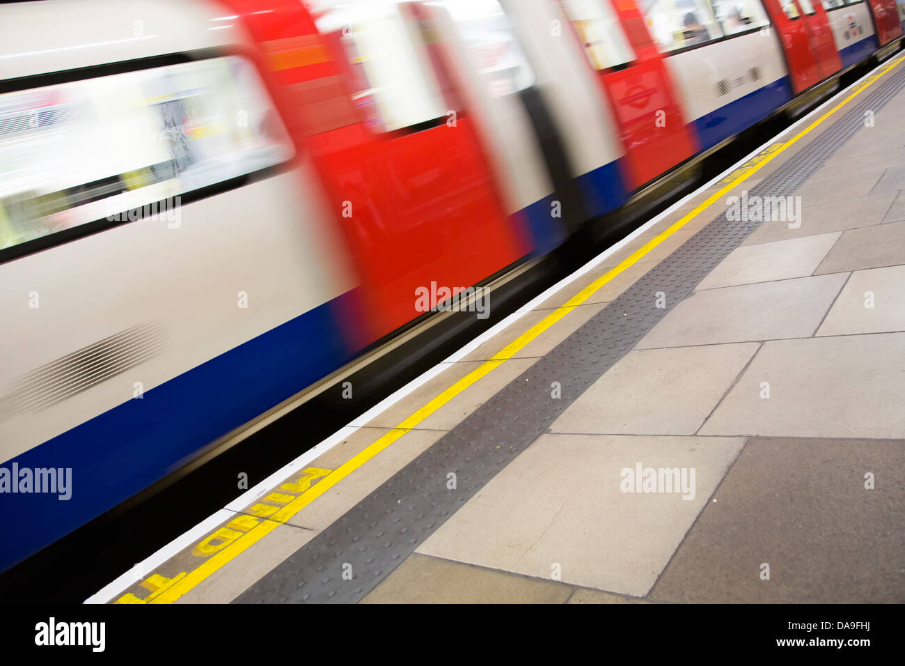 Speeding train passing through station uk hi-res stock photography and ...