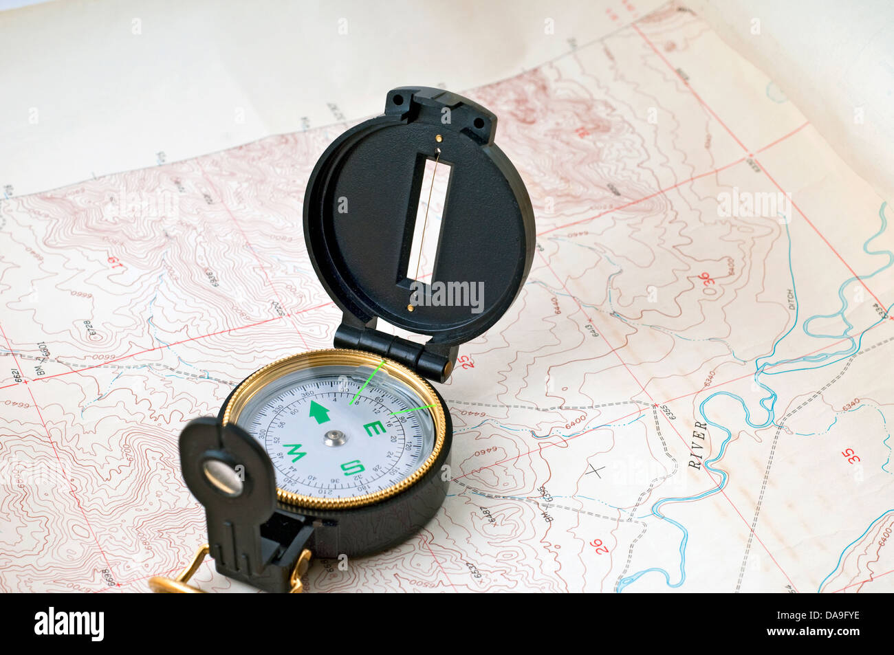 compass laid out over a topographical map Stock Photo - Alamy