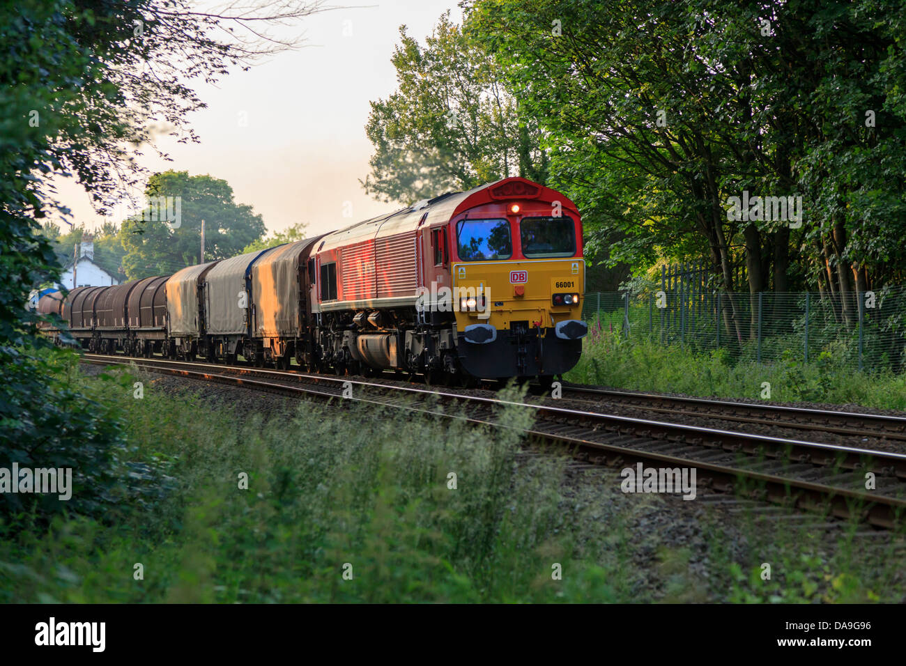 DB Schenker liveried Class 66 (No 66001) passes Weston Rhyn level ...