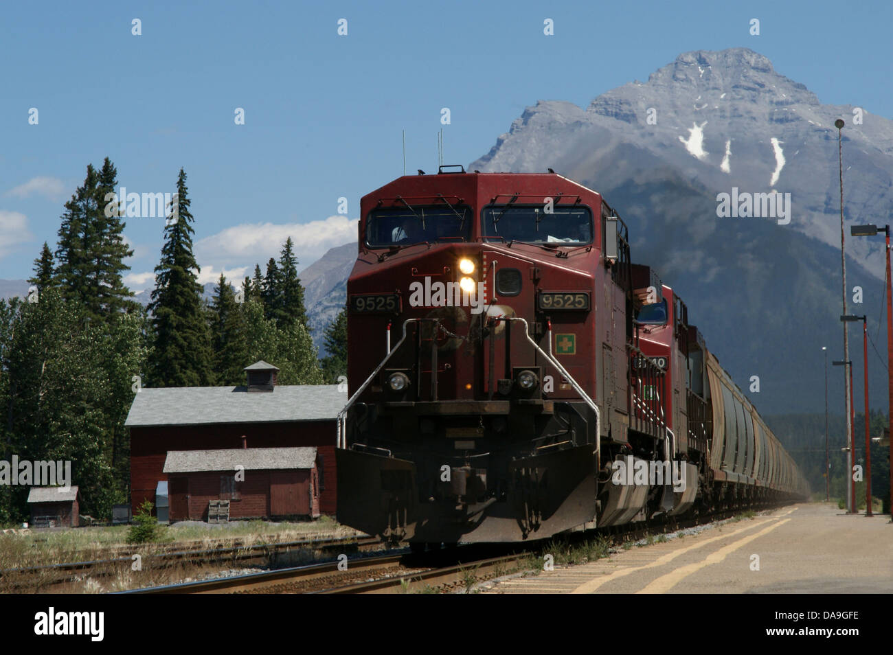 A Canadian Pacific Freight train highballs through Banff, Alberta Stock Photo - Alamy