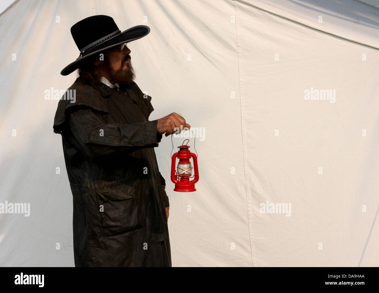 Cowboy holding lantern tent hi-res stock photography and images - Alamy