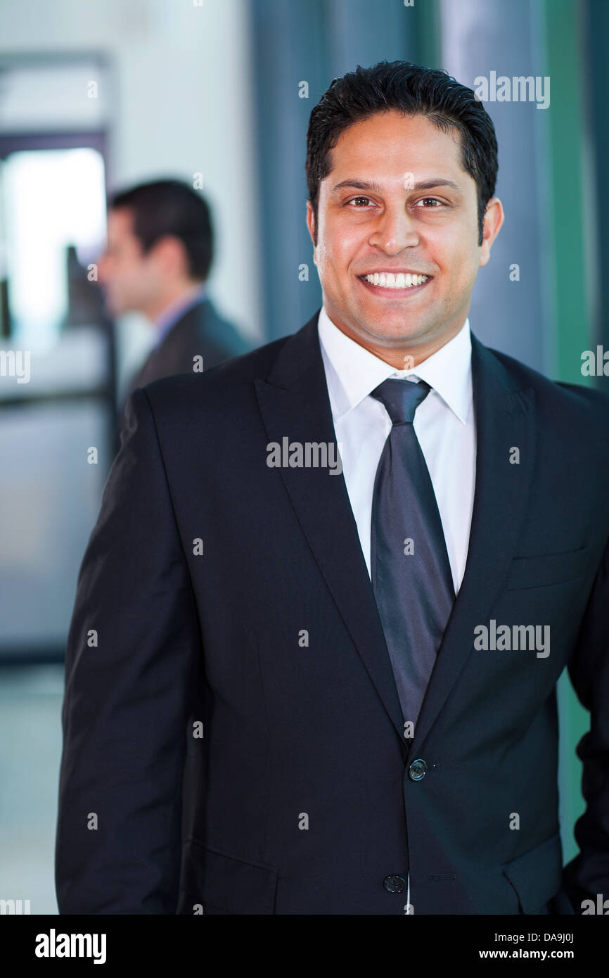 confident male Indian business executive in modern office Stock Photo ...