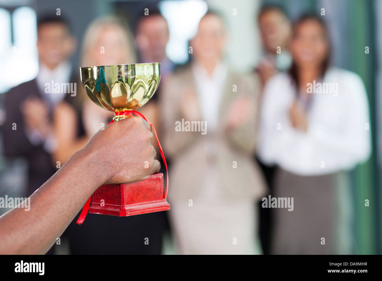 Team winning trophy hi-res stock photography and images - Alamy