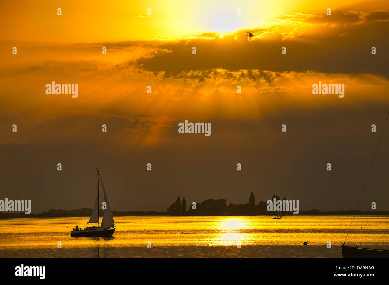 Yacht silhouetted against sunset Steinhuder am Meer Stock Photo - Alamy