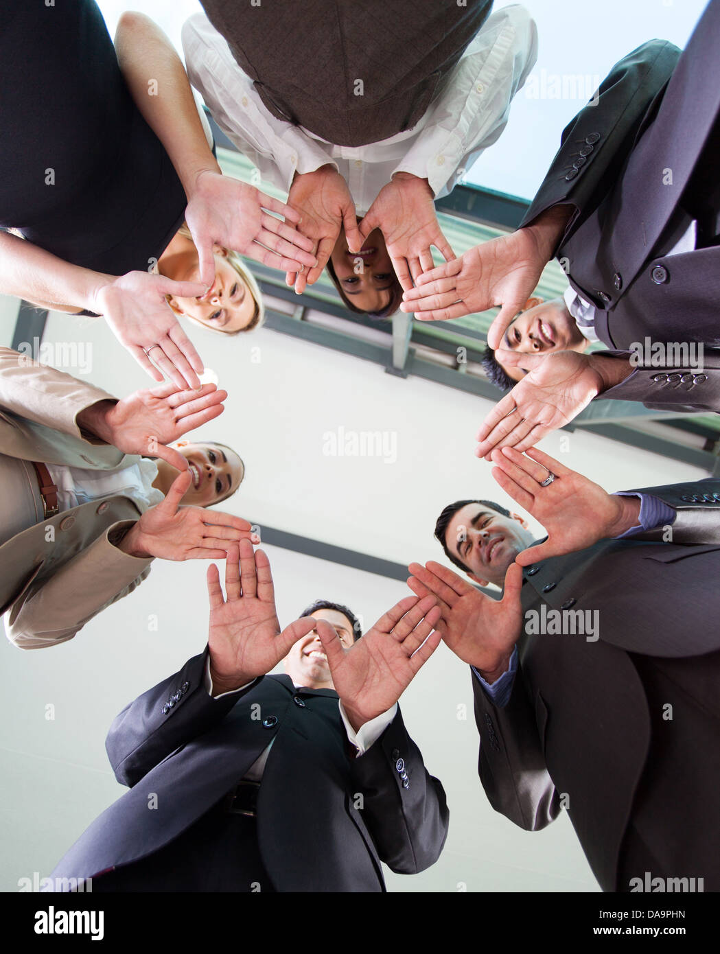 low angle view of business team hands together in circle Stock Photo ...
