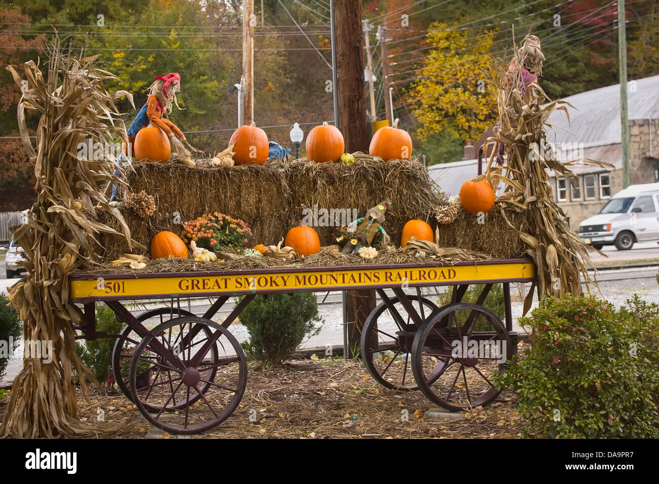fall railroad display with mums, pumpkins, and scarecrows on a antique ...