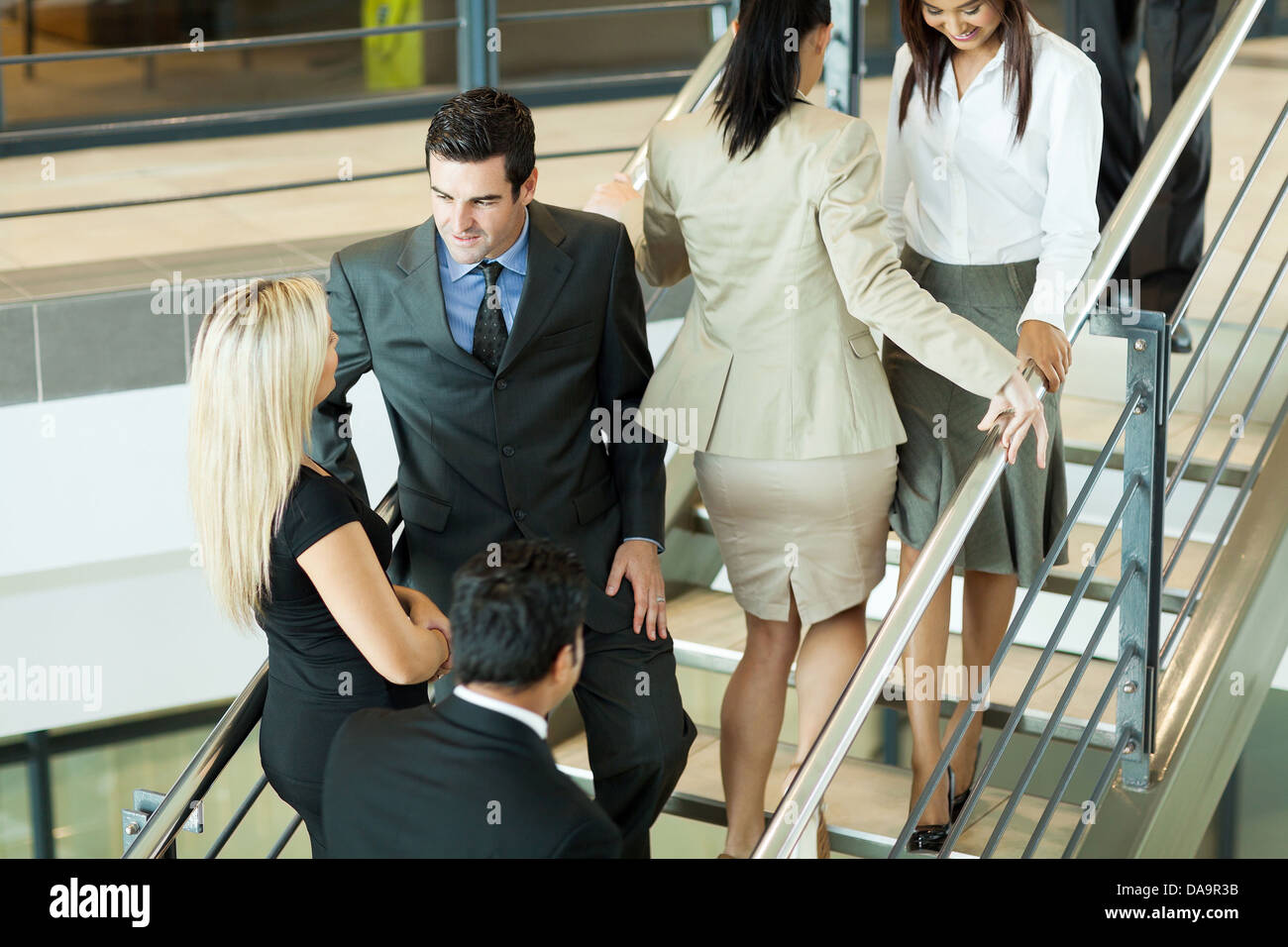 group of busy office workers walking on stairs Stock Photo - Alamy
