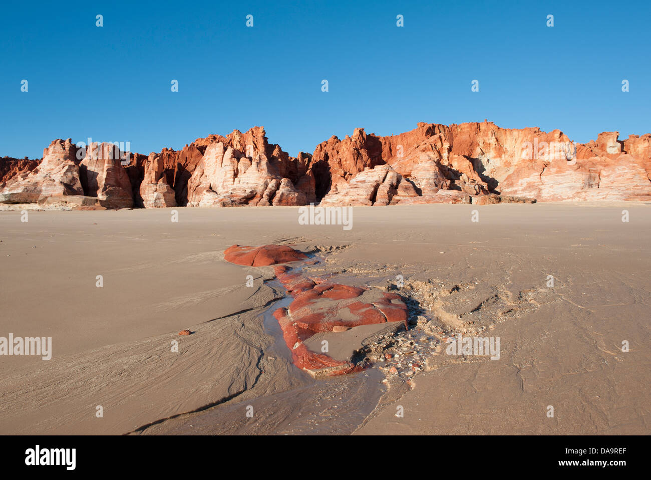 The famous eroded sandstone cliffs of the Western beach at Cape Leveque ...