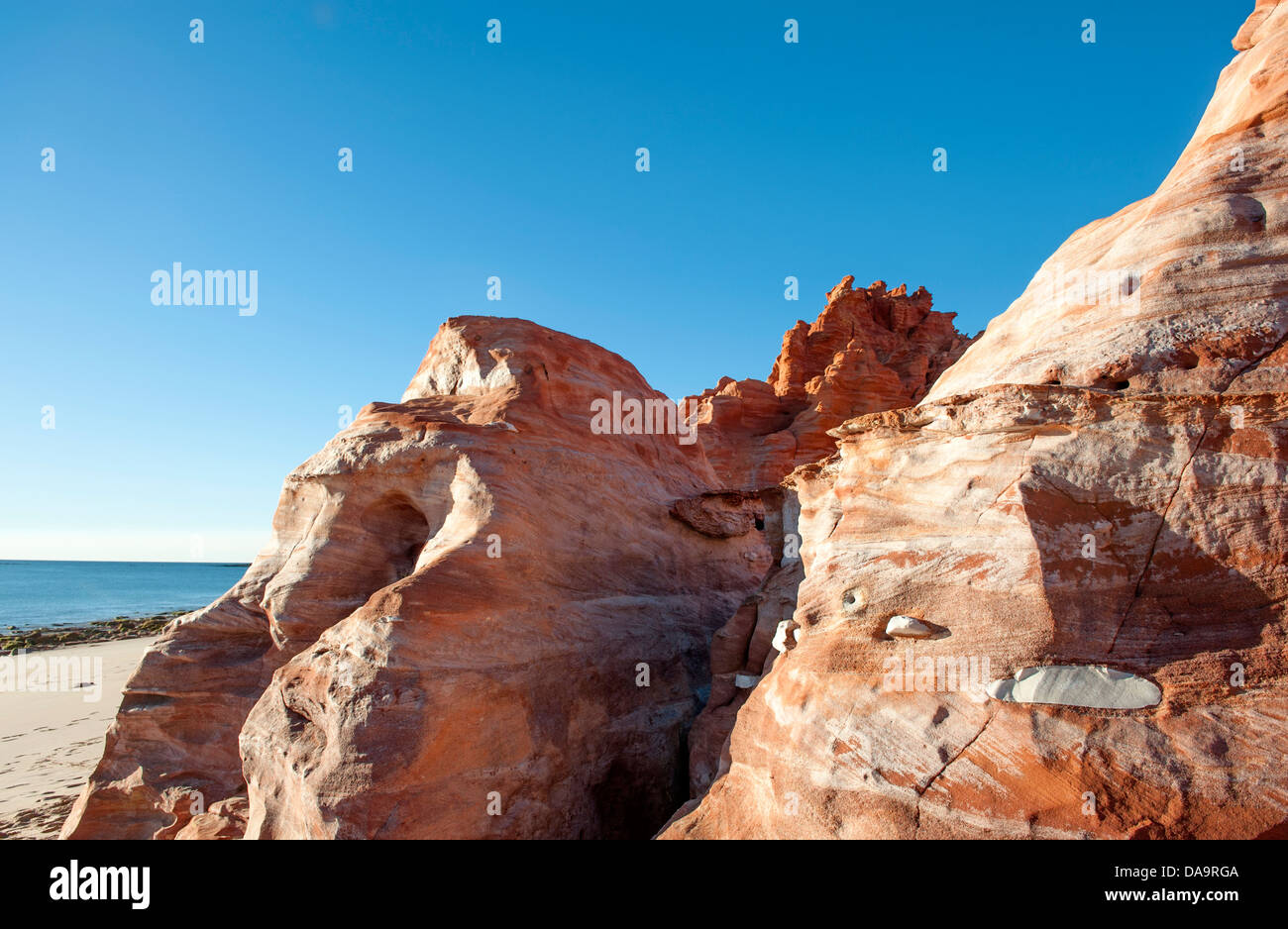 The famous eroded sandstone cliffs of the Western beach at Cape Leveque ...