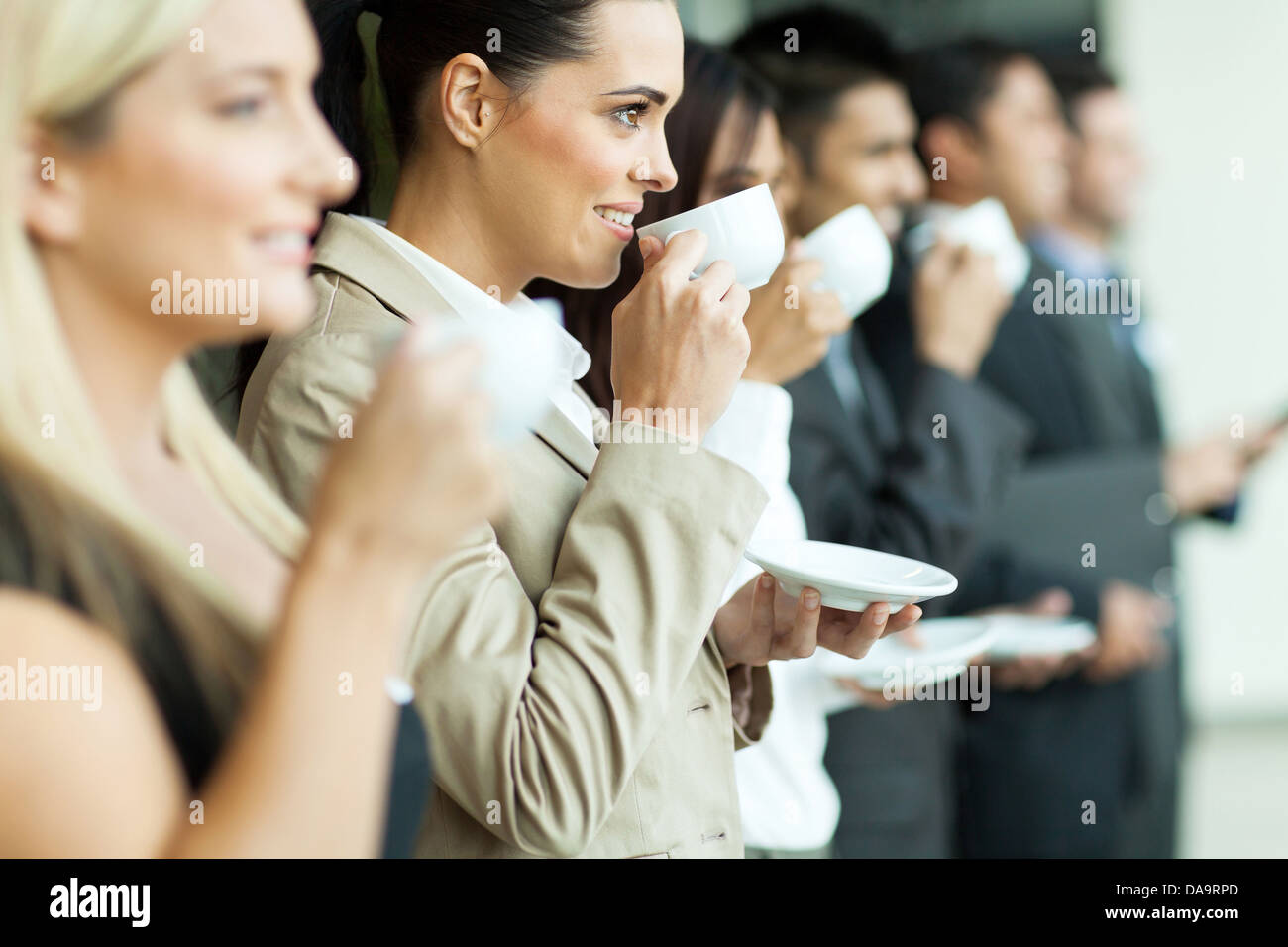 group of businesspeople having coffee during conference coffee break ...