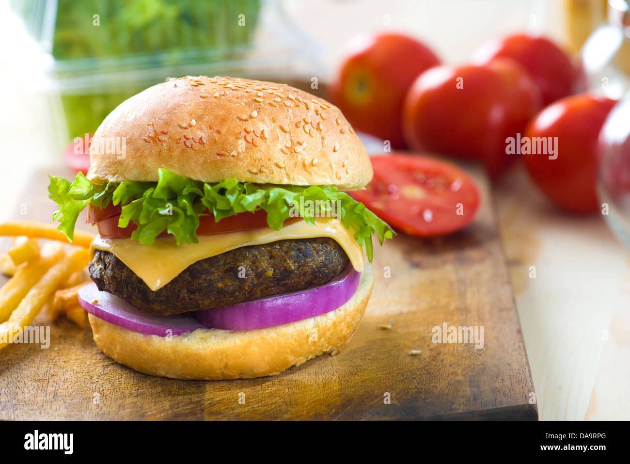 hamburger fast food with plenty of raw materials on the background ...
