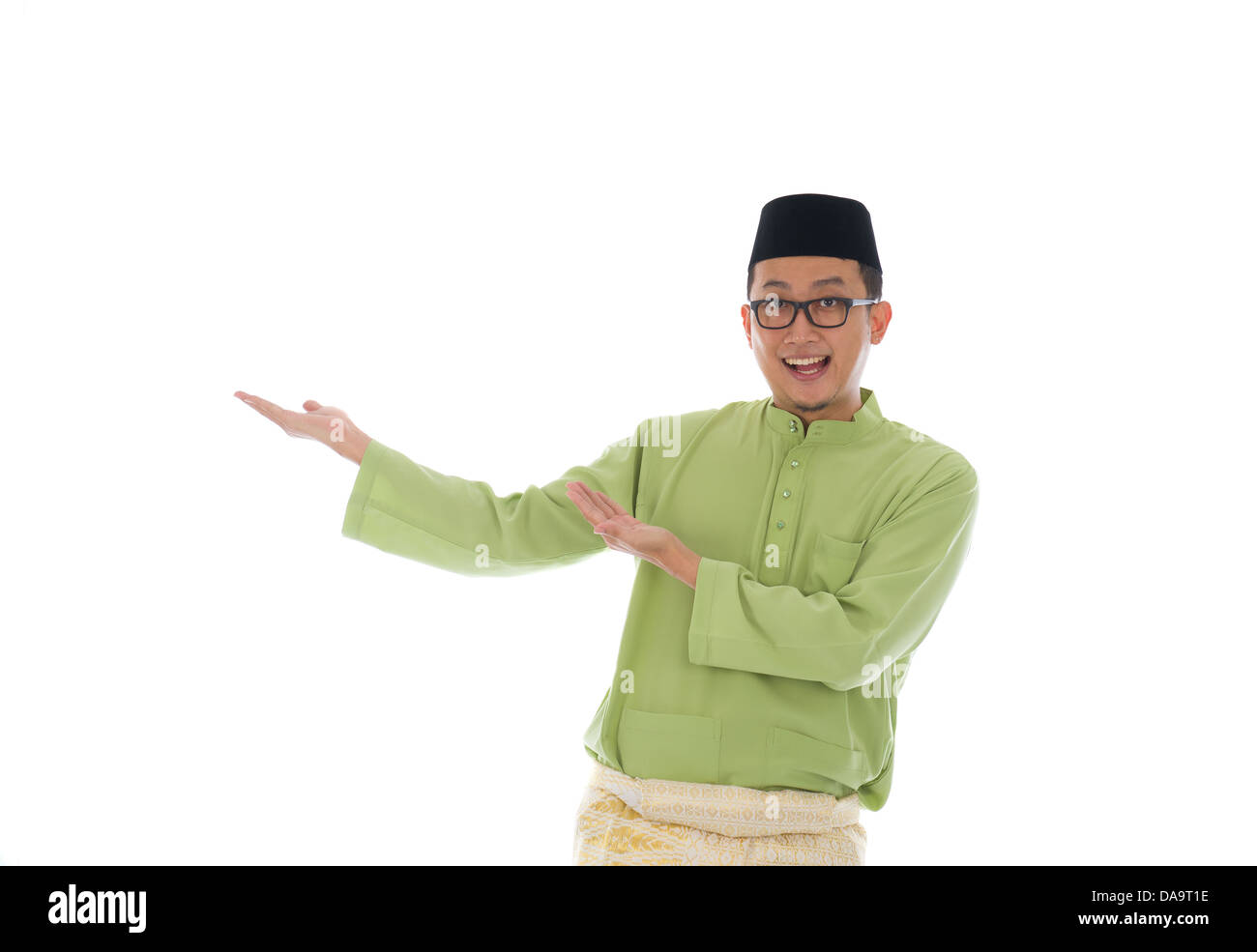 Traditonal Malay man with welcome gesture during ramadan isolated white ...