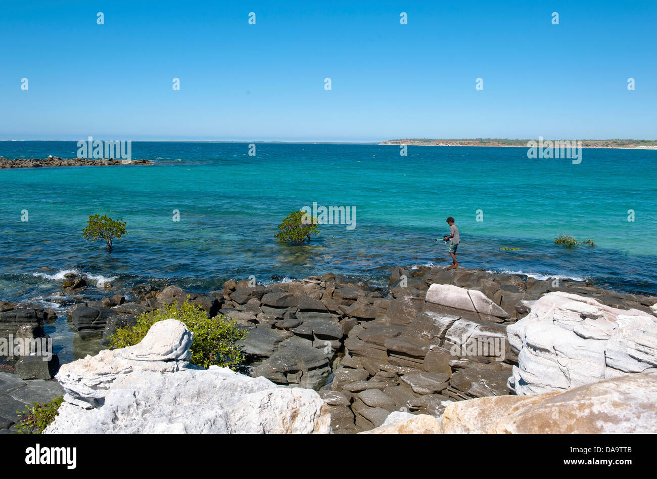 Rocky Bay with sandy beach and mangrove mudflats at One Arm Point, Cape ...