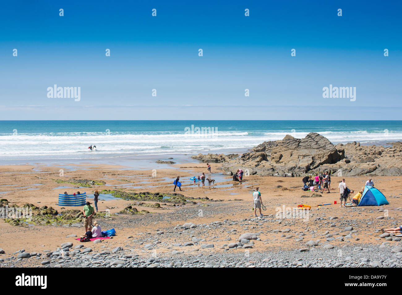 People relax on the beach at Sandymouth Bay, north Devon, England Stock ...