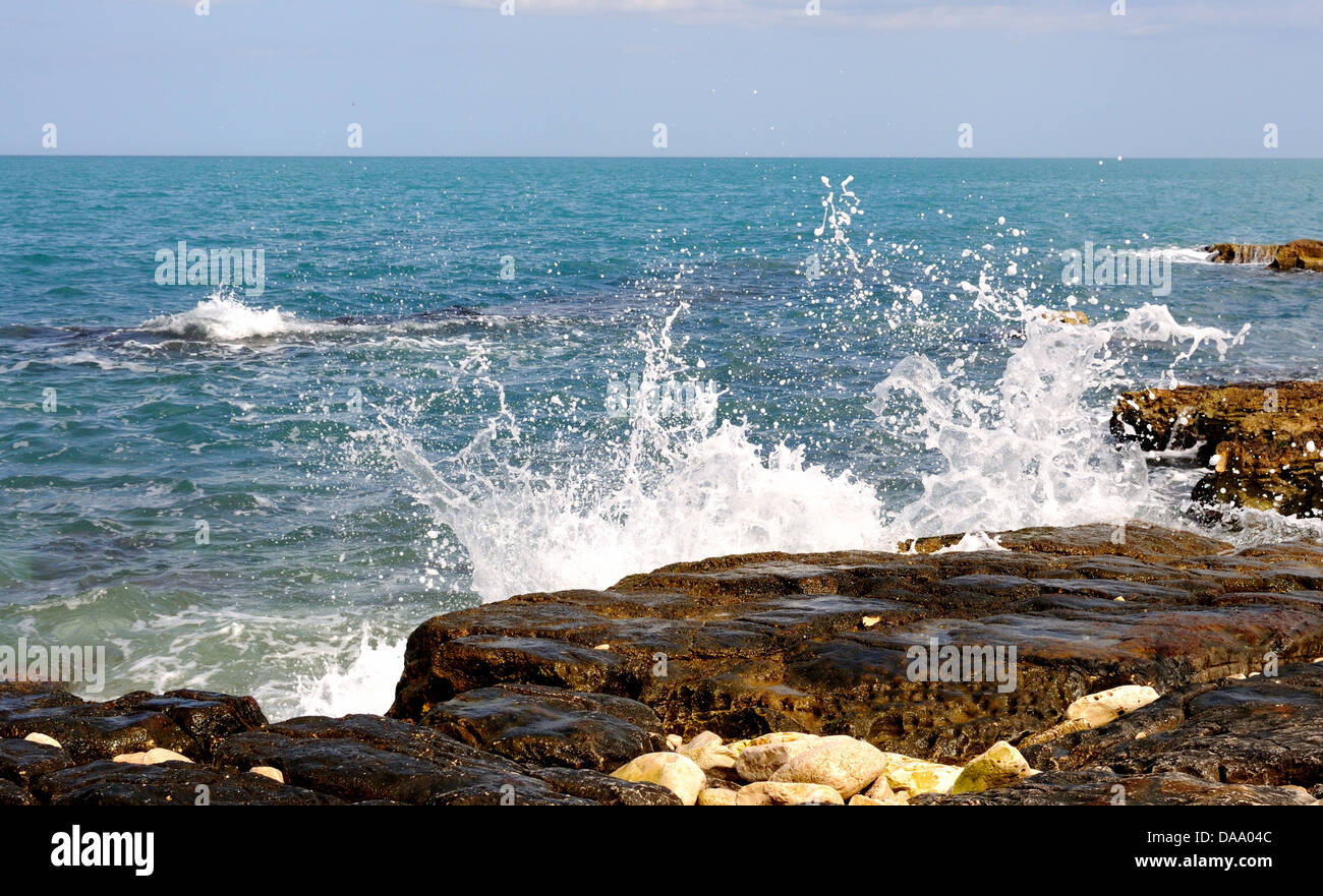 waves crashing on the rocks of a beach Stock Photo - Alamy