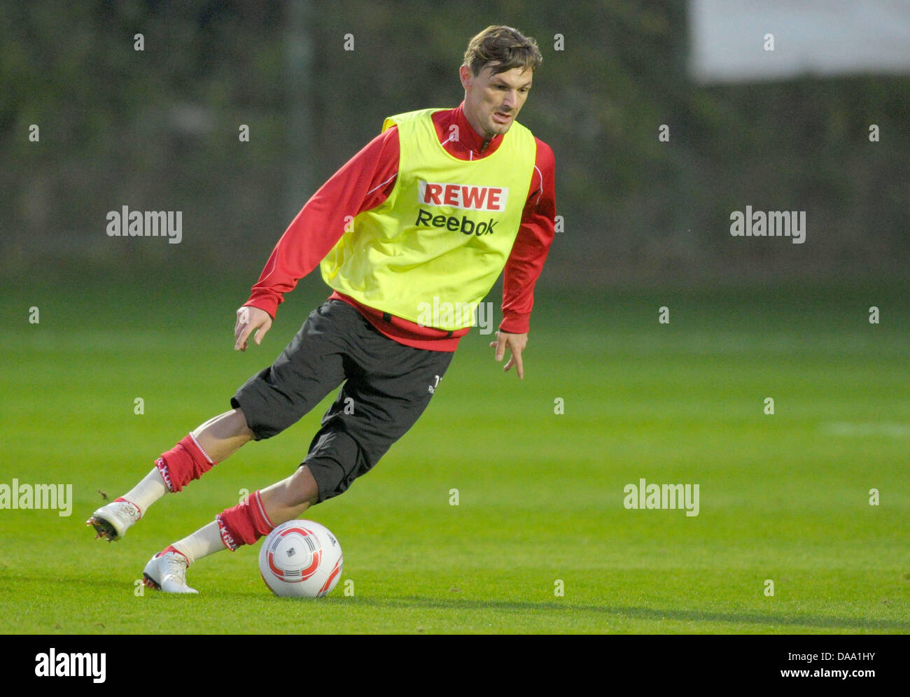 Cologne's Milivoje Novakovic controls the ball during a training camp ...
