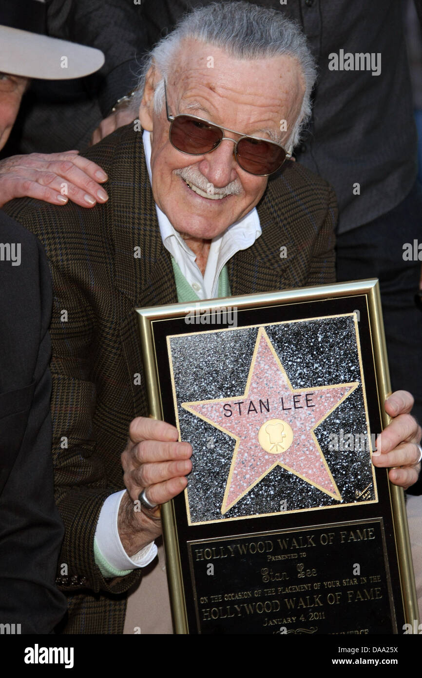 US artist and comic book creator Stan Lee poses with a replica plaque ...