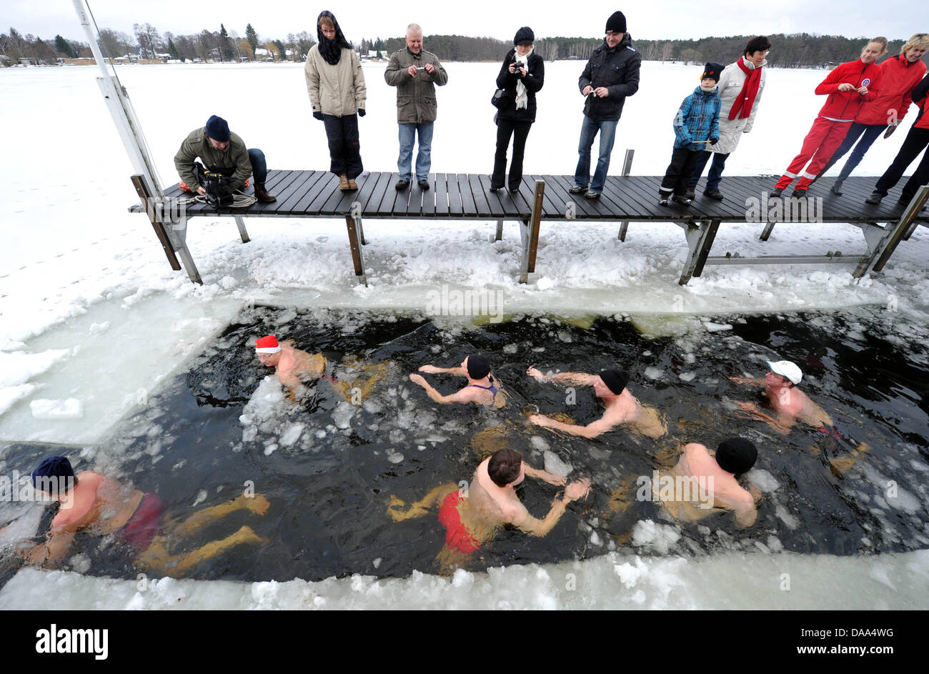 Ice-swimmers enjoy their cool bath at the Great Muellrose Lake in ...