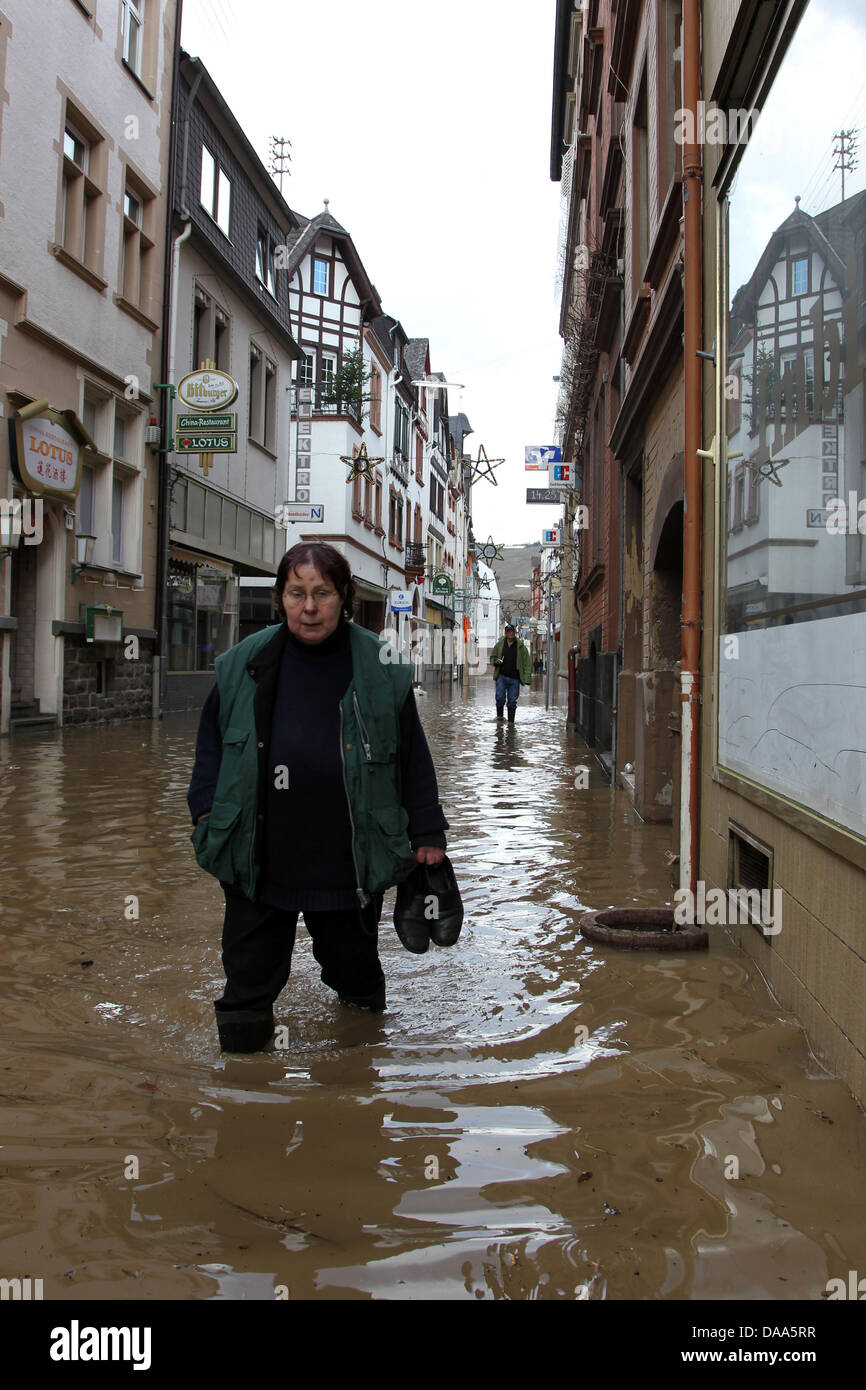 A man wades through the flood waters in the old city wearing wellies in ...
