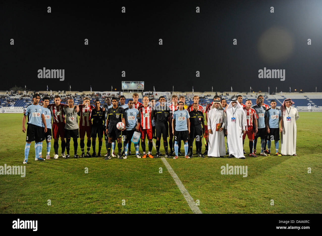 The players of Al-Wakrah and Bayern Munich line up for a group photo in ...