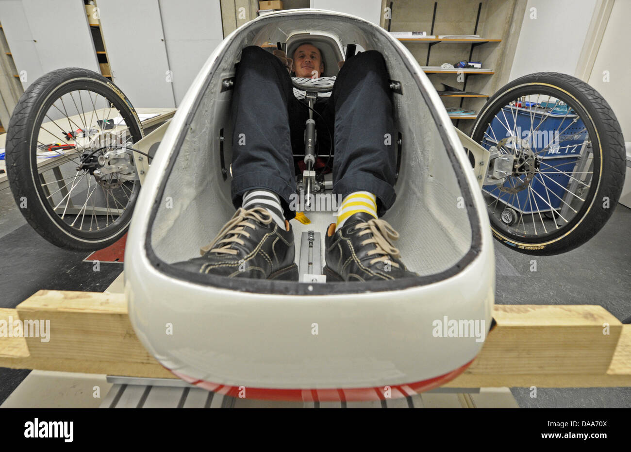 Electromechanics professor Juergen Walter lies in the battery car 'E ...