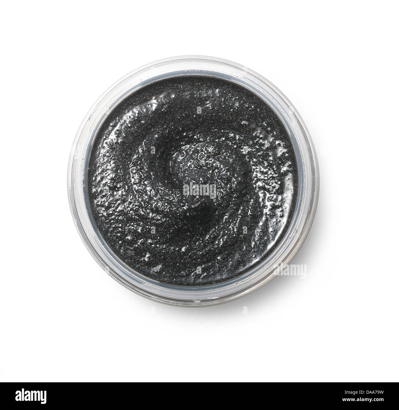 pot of black body scrub paste cut out onto a white background Stock ...