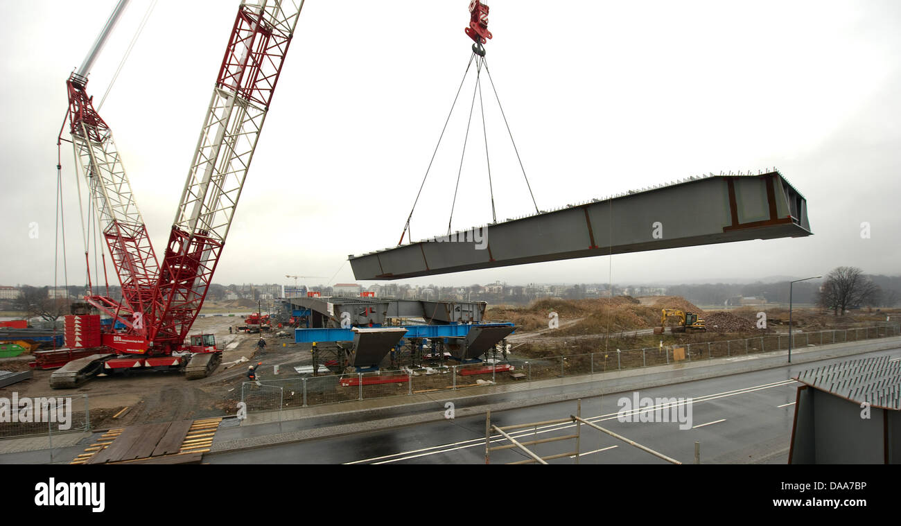 A crane lifts a girder of the Waldschloesschen Bridge over a street in ...