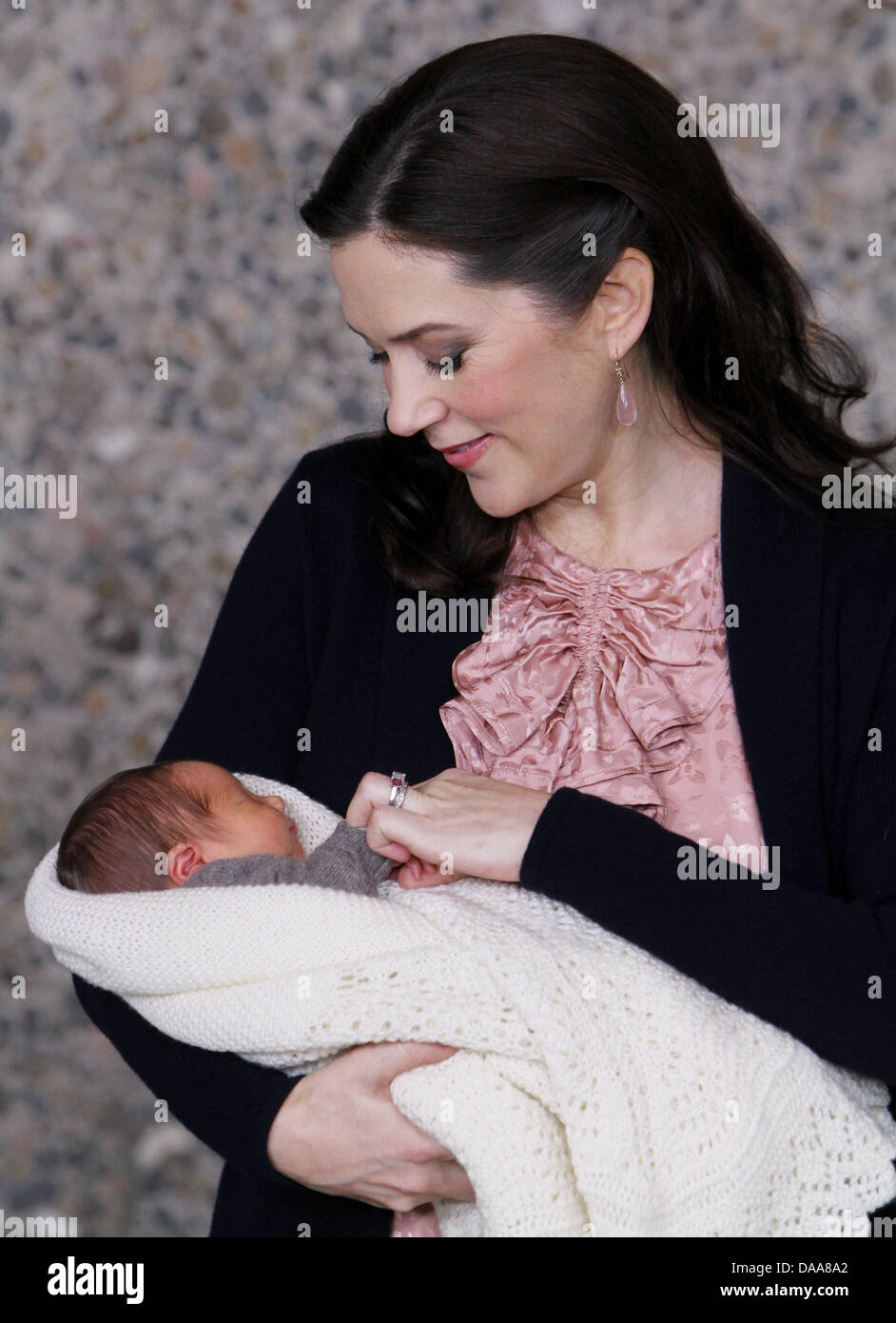 Princess Mary of Denmark leaves Rigshospitalet hospital in with one of ...